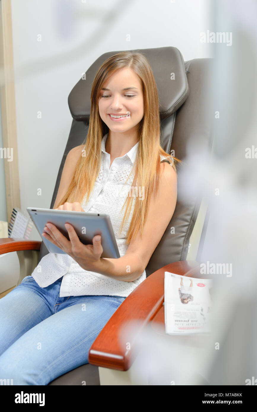 girl in reclining chair Stock Photo - Alamy