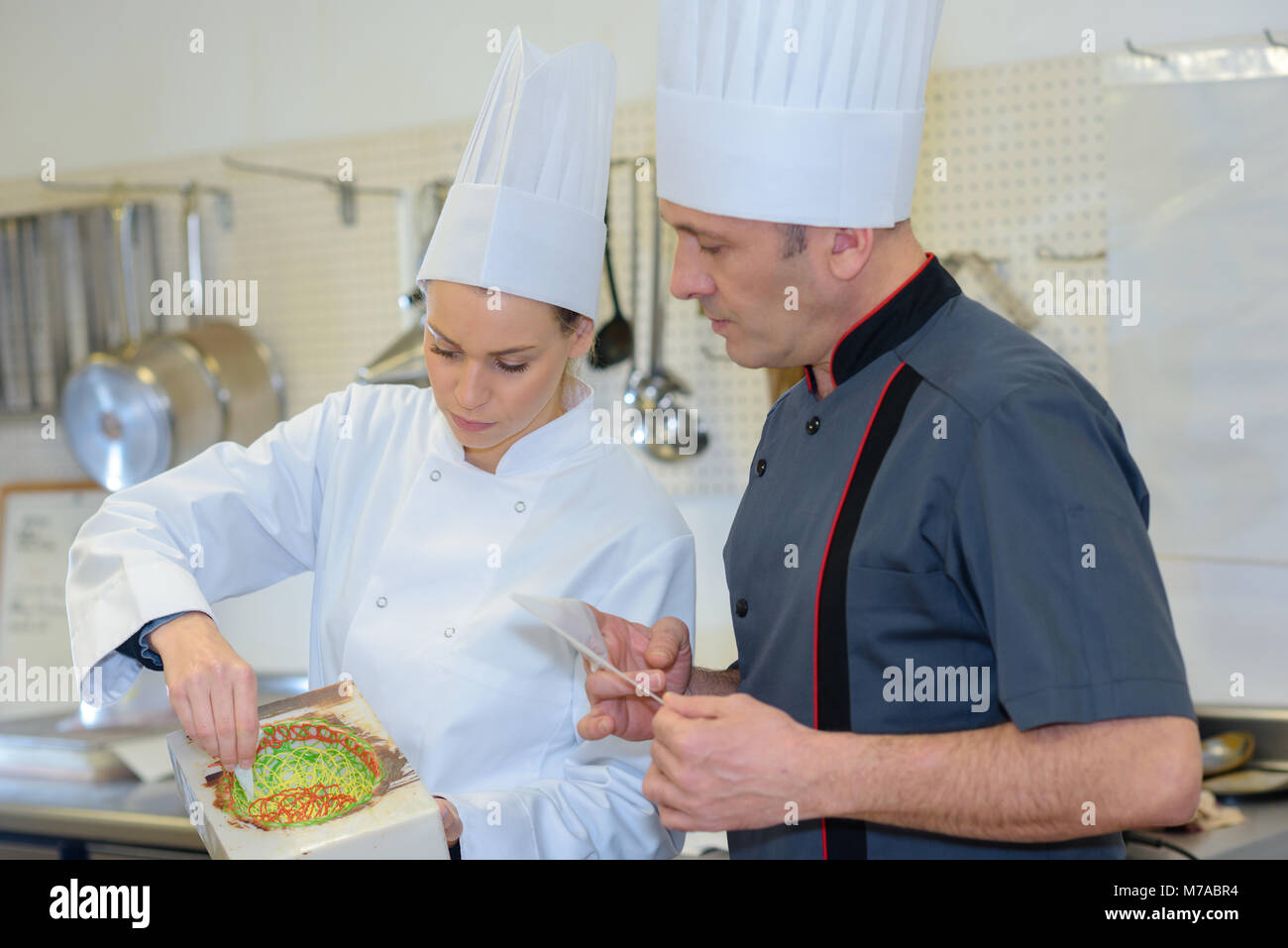 In his kitchen with his assistant chefs hi-res stock photography and ...