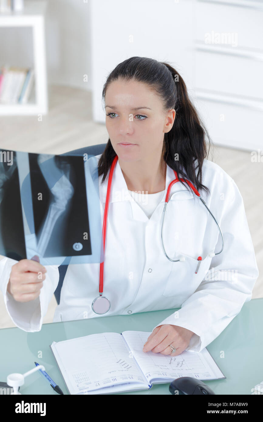doctor looking at the x-ray picture of hand Stock Photo - Alamy