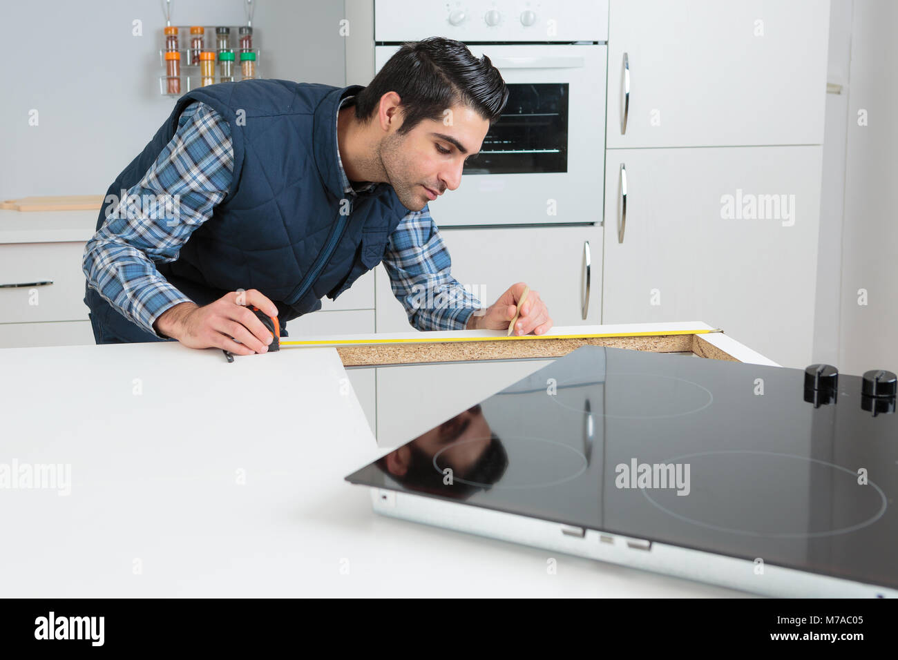 installing an electronic cooker Stock Photo - Alamy