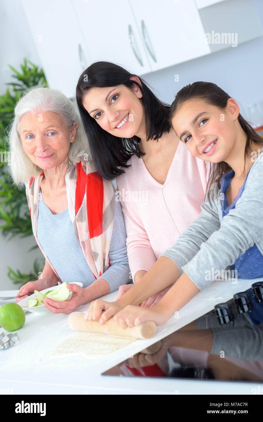 Three generations of women baking together Stock Photo - Alamy