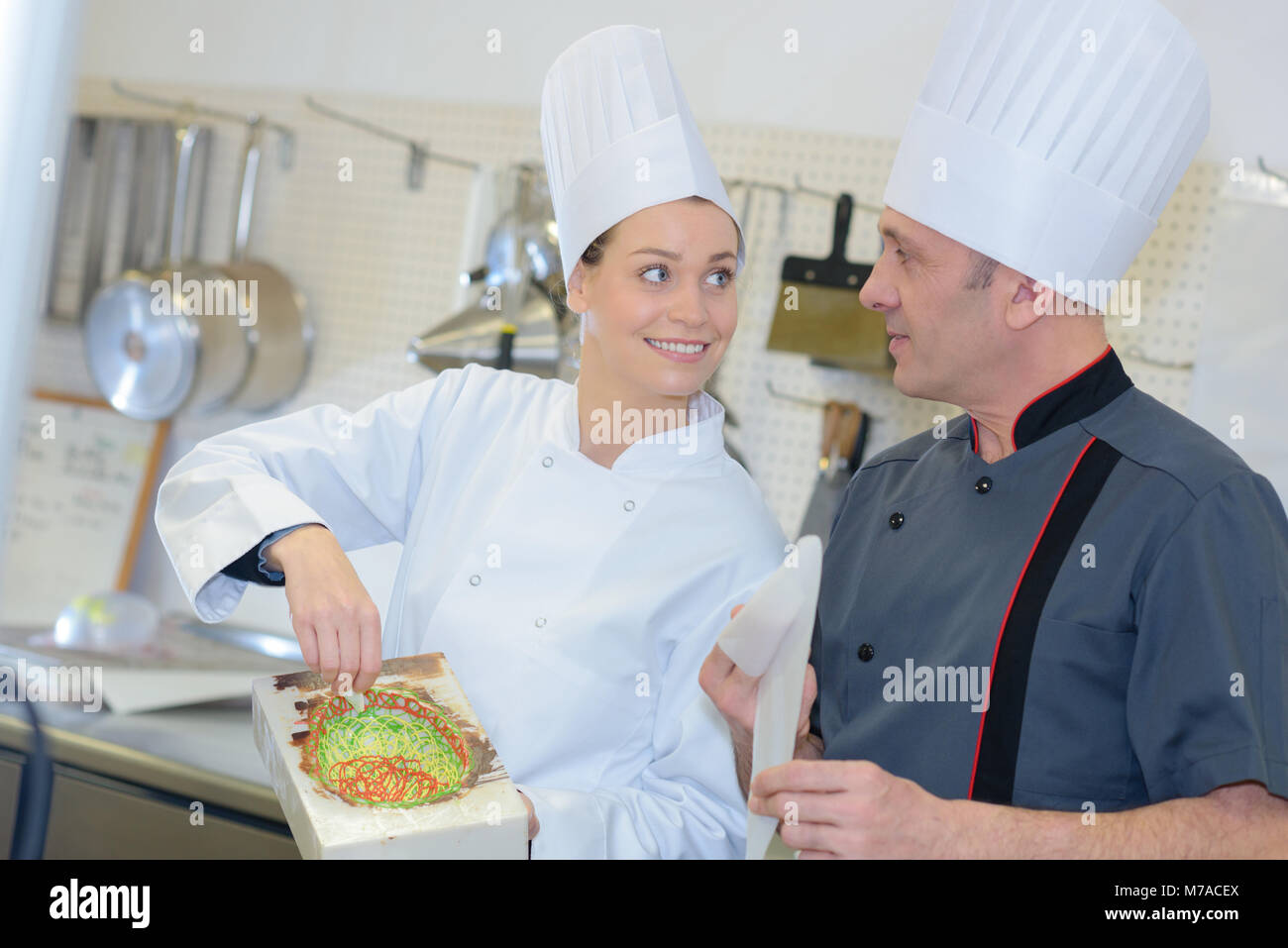 male and female chefs working at kitchen Stock Photo - Alamy