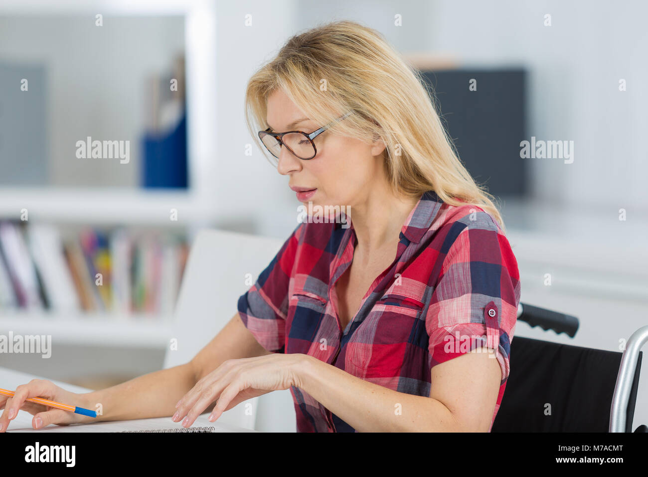female working on project Stock Photo - Alamy