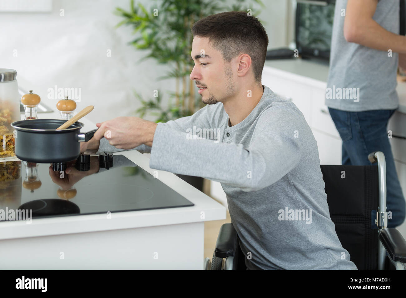 disabled friend cooking Stock Photo - Alamy