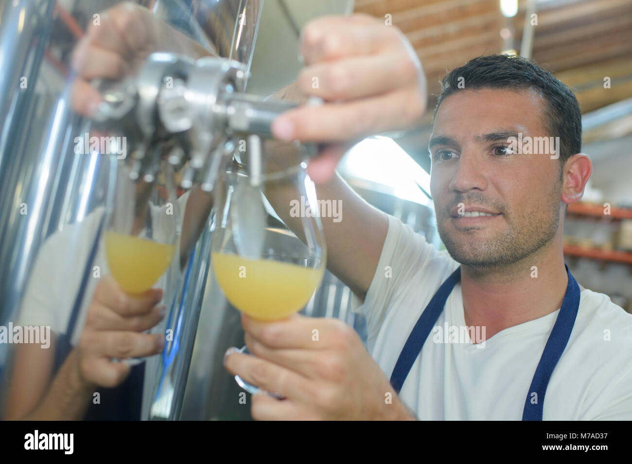 distillery worker taking sample Stock Photo - Alamy