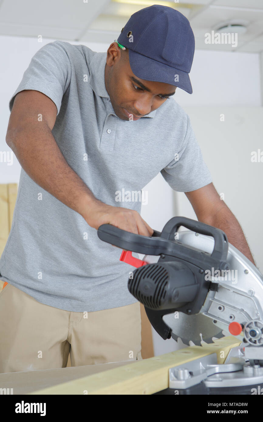 Man using circular saw Stock Photo - Alamy