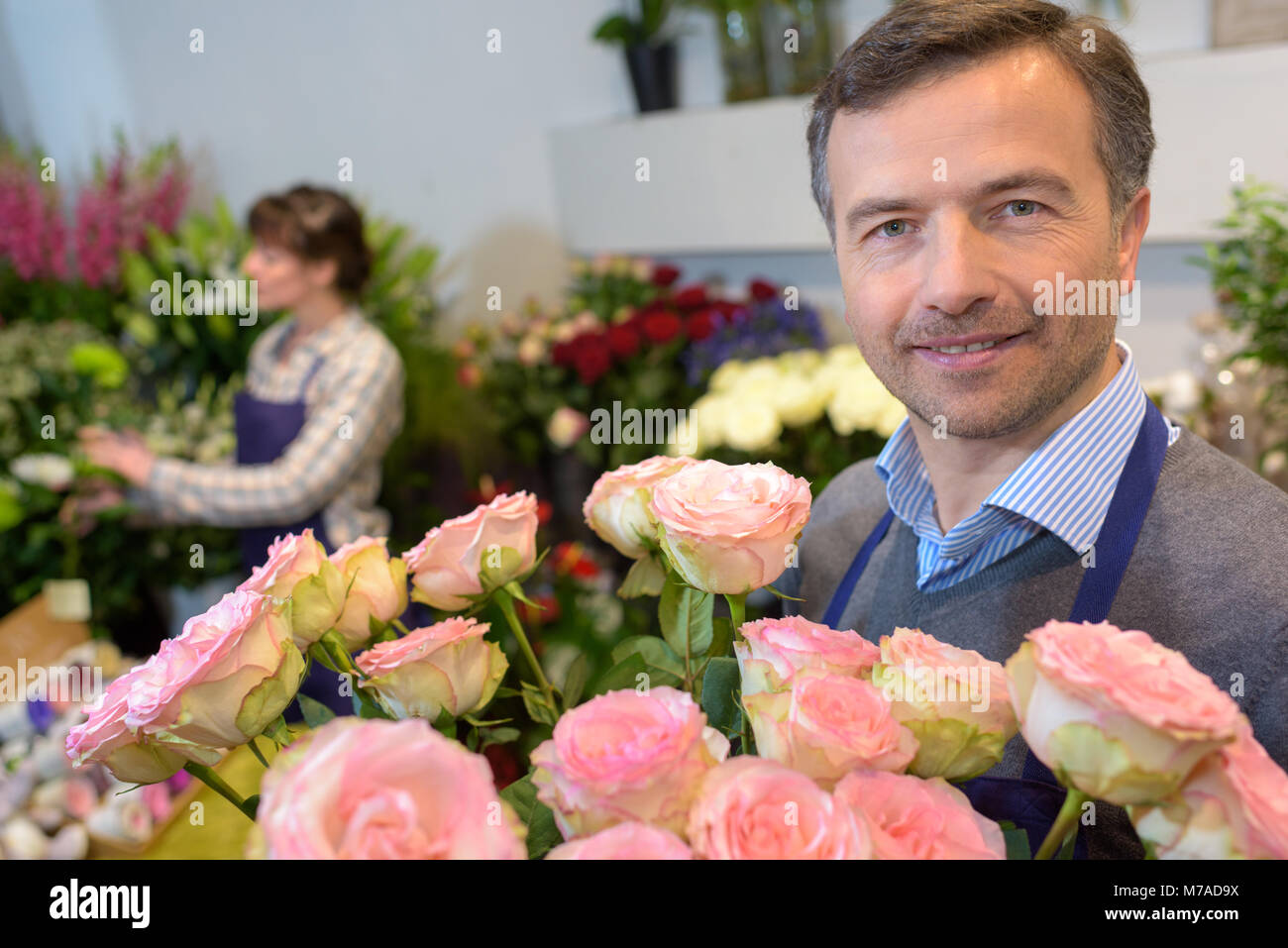 florist posing with flowers Stock Photo - Alamy