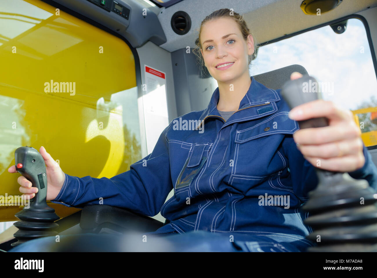 Woman operating crane Stock Photo - Alamy