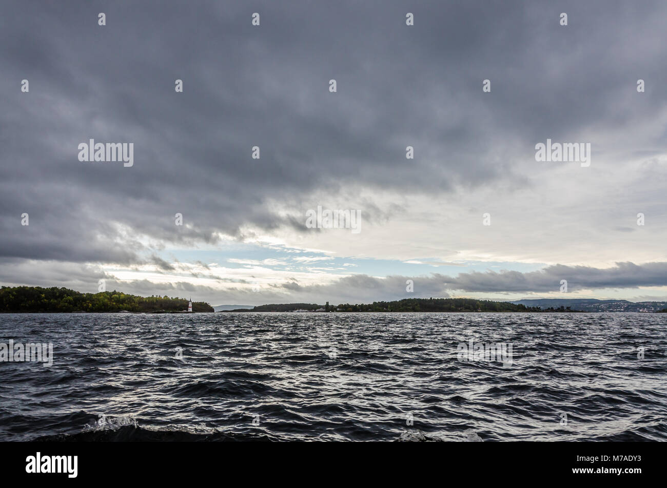 Small waves in the port of Oslo under clouds sky, Norway Stock Photo ...