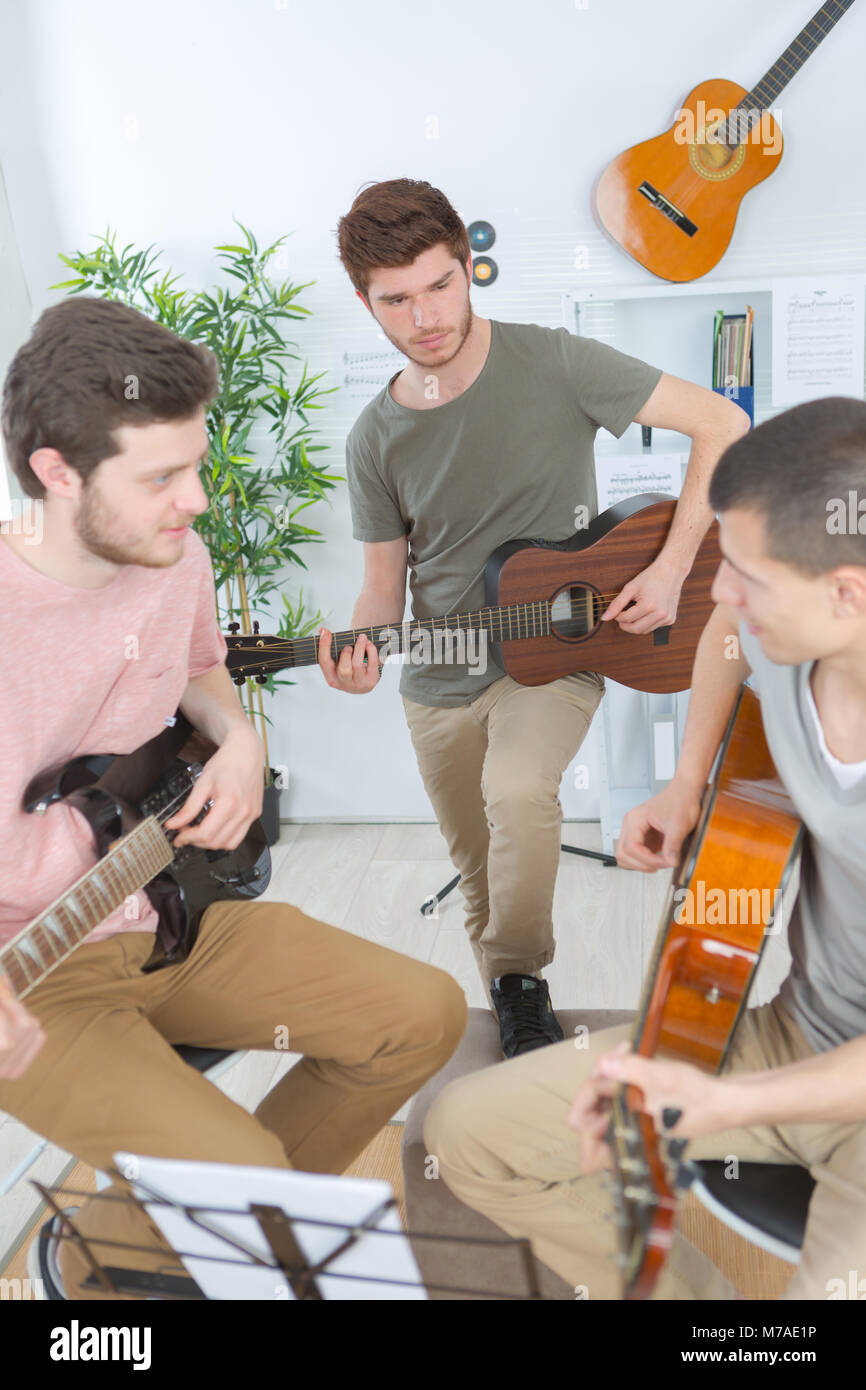group of friends playing guitar at home Stock Photo - Alamy