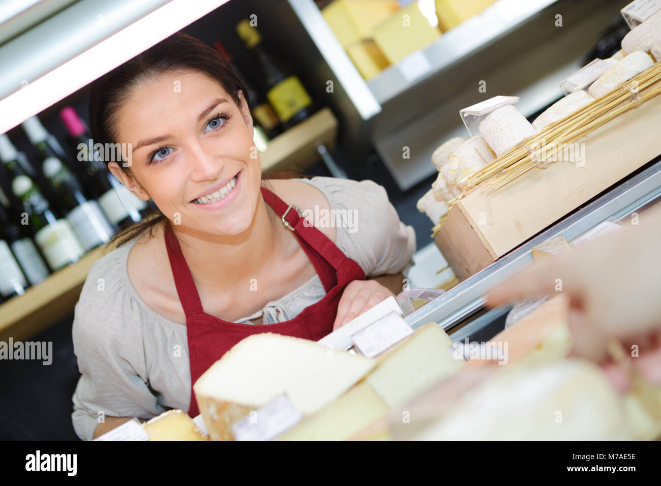 happy female brunette with different types of cheese Stock Photo - Alamy