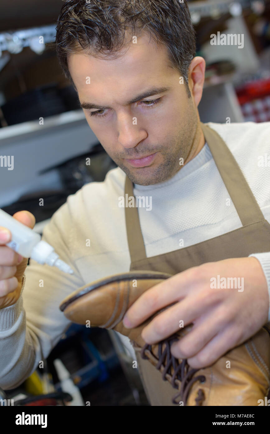 Fixing things clothing hi-res stock photography and images - Alamy