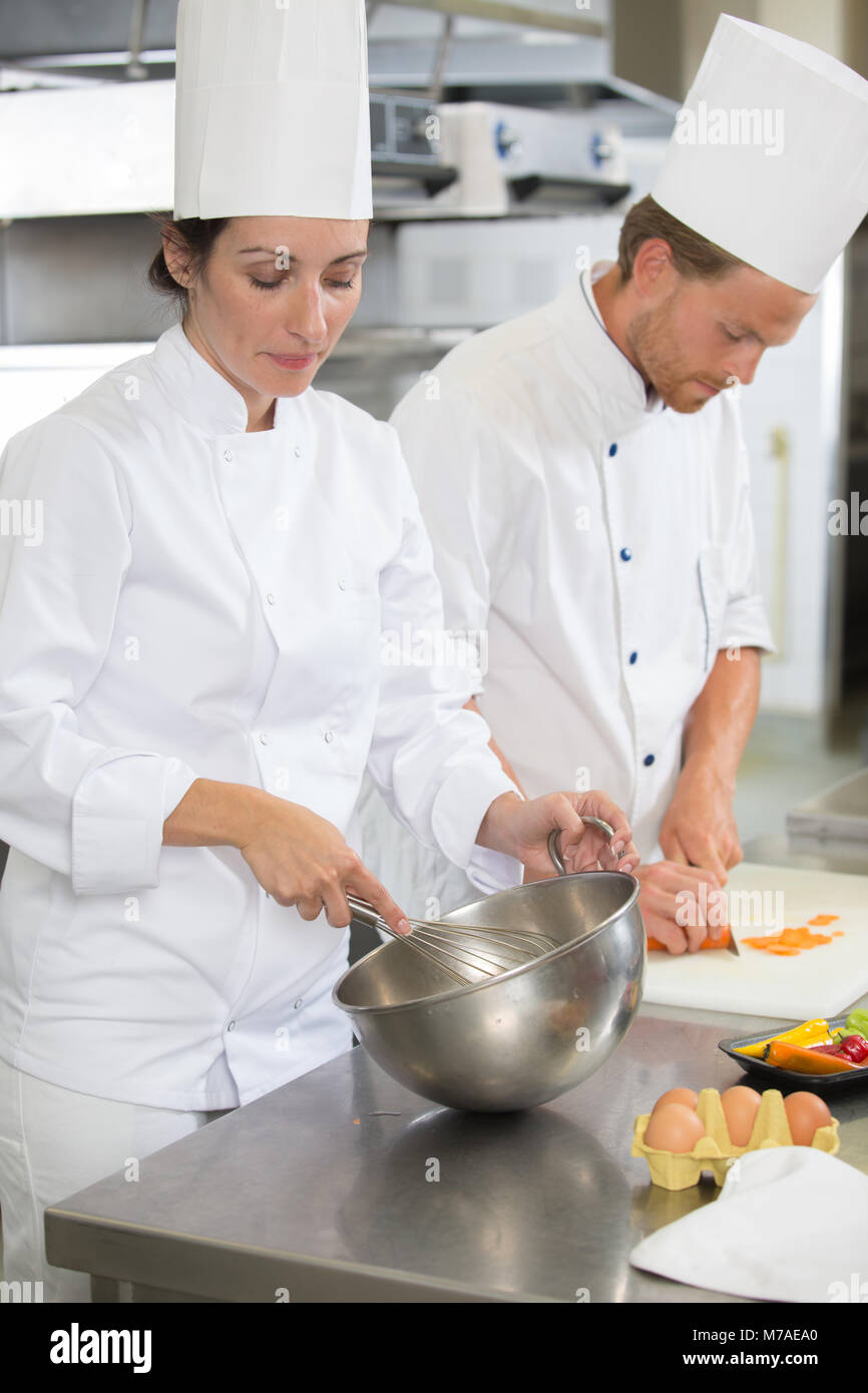 male and female chefs working at kitchen Stock Photo - Alamy