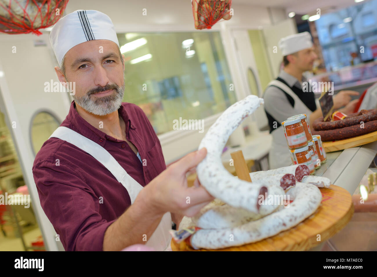 seller at the ham meat counter in a supermarket Stock Photo - Alamy