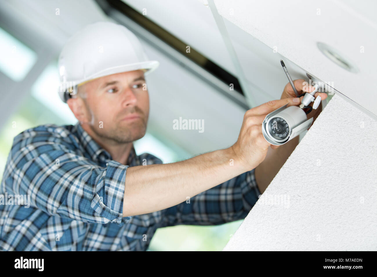 professional cctv technician working Stock Photo - Alamy