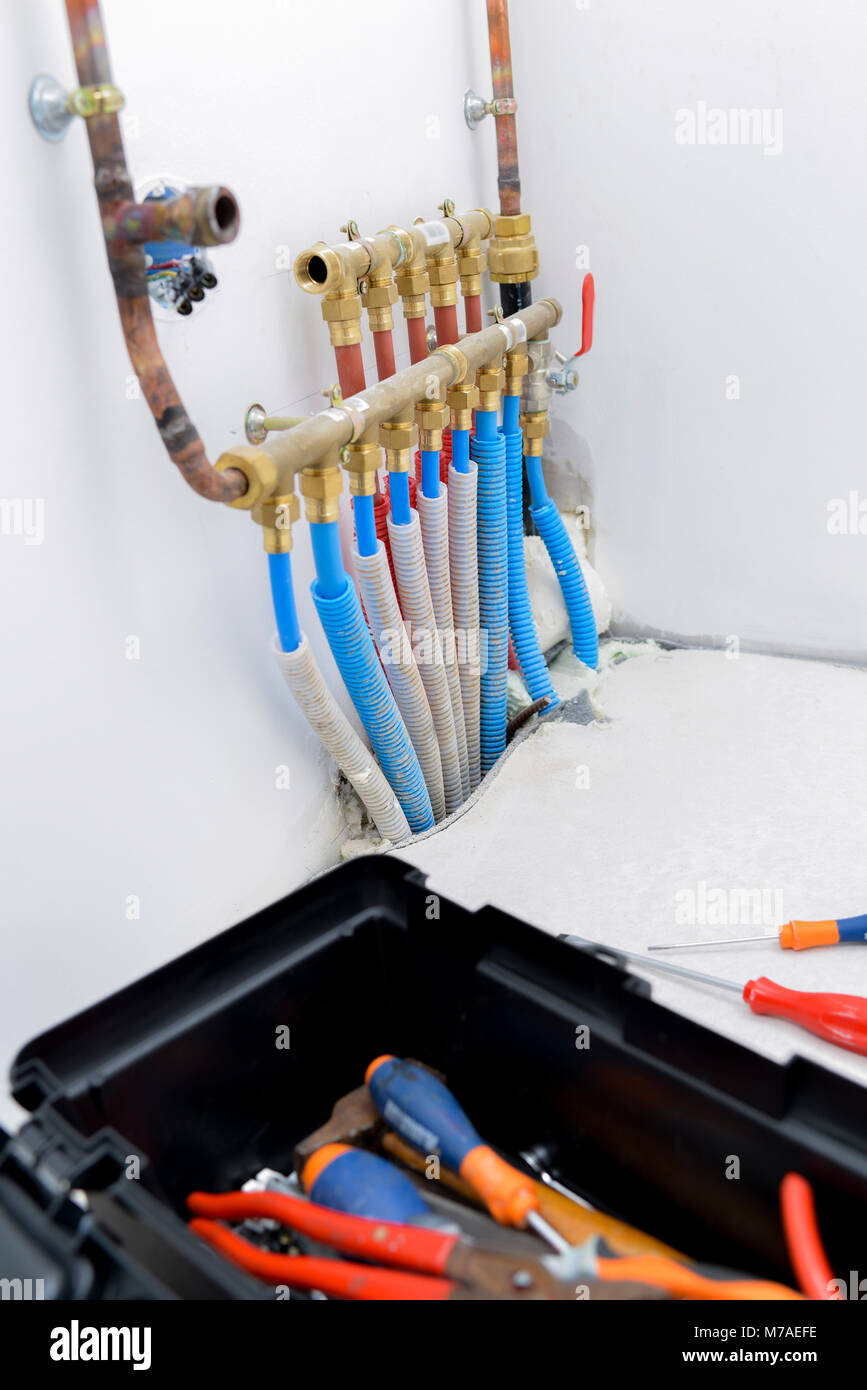 Plumber installing a system of piping Stock Photo - Alamy