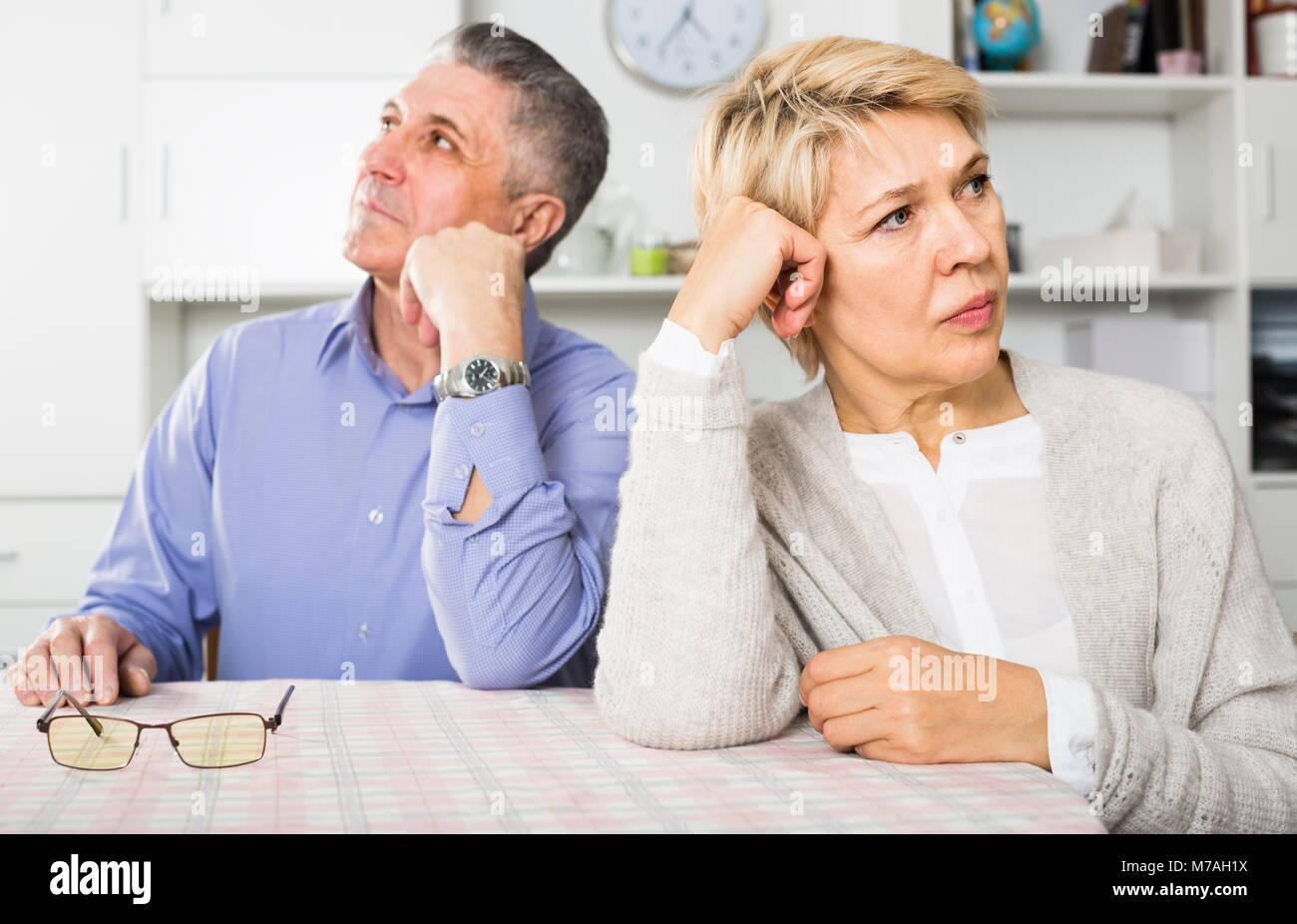 mature couple quarreling at home with each other and take offense Stock ...