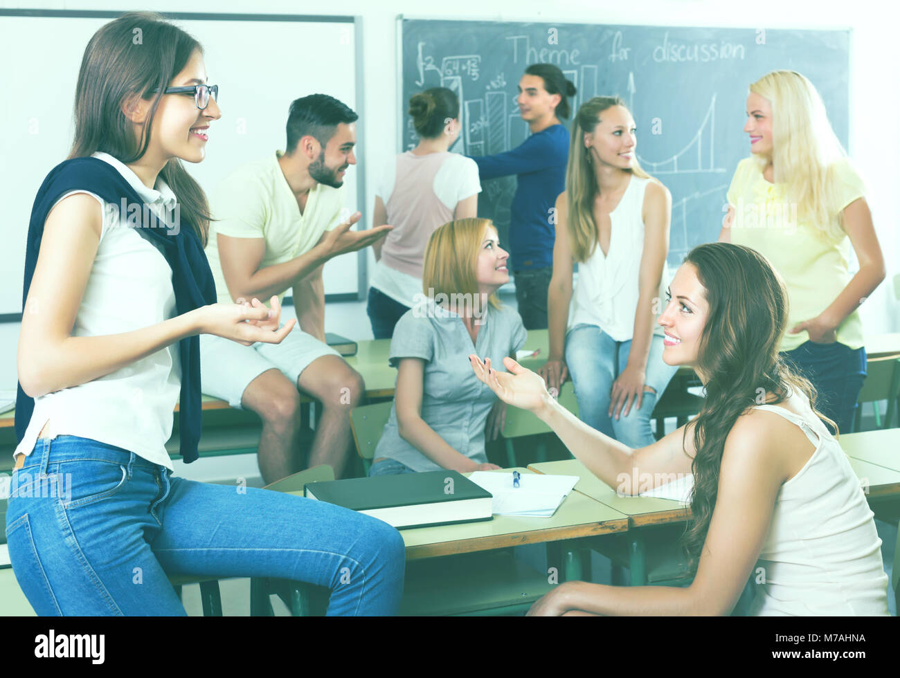 Young students communication sitting in the classroom Stock Photo - Alamy