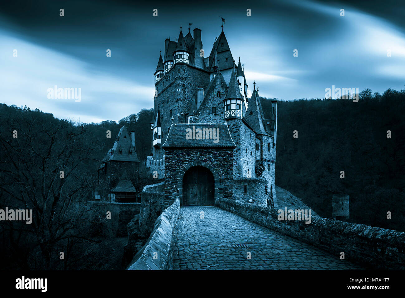 The Eltz Castle close Münstermaifeld in the Eifel in mystically blue ...