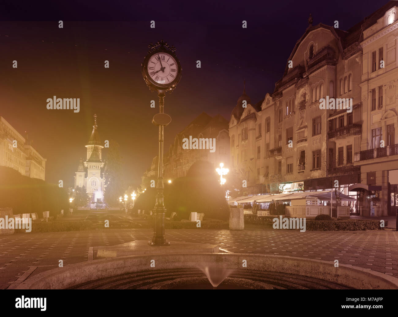 Night view of Victoriei Square on background with Romanian Orthodox ...