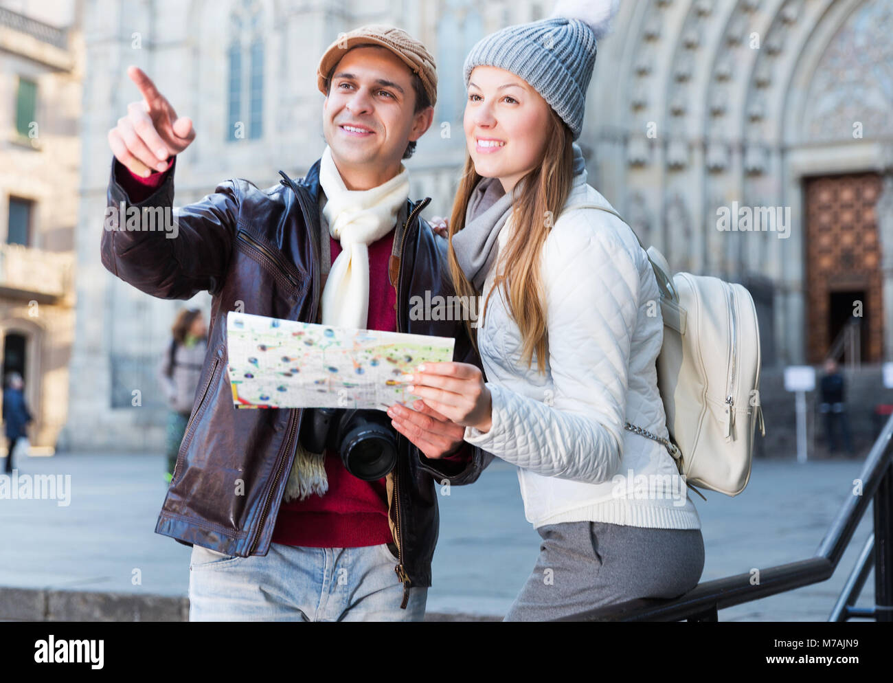 atractive male and female in the historic center pointing finger Stock ...