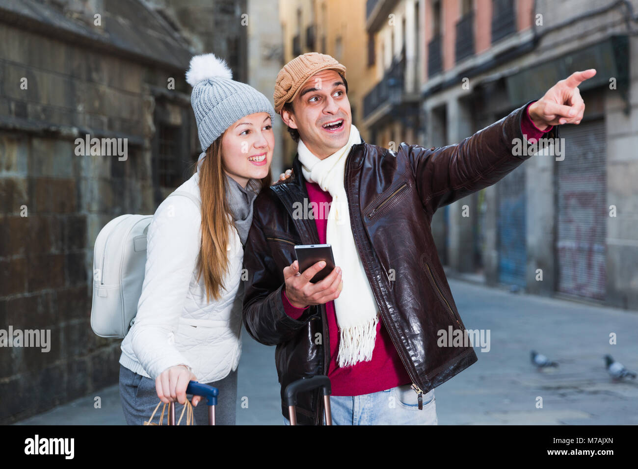 Positive male and female in the historic center pointing finger Stock ...