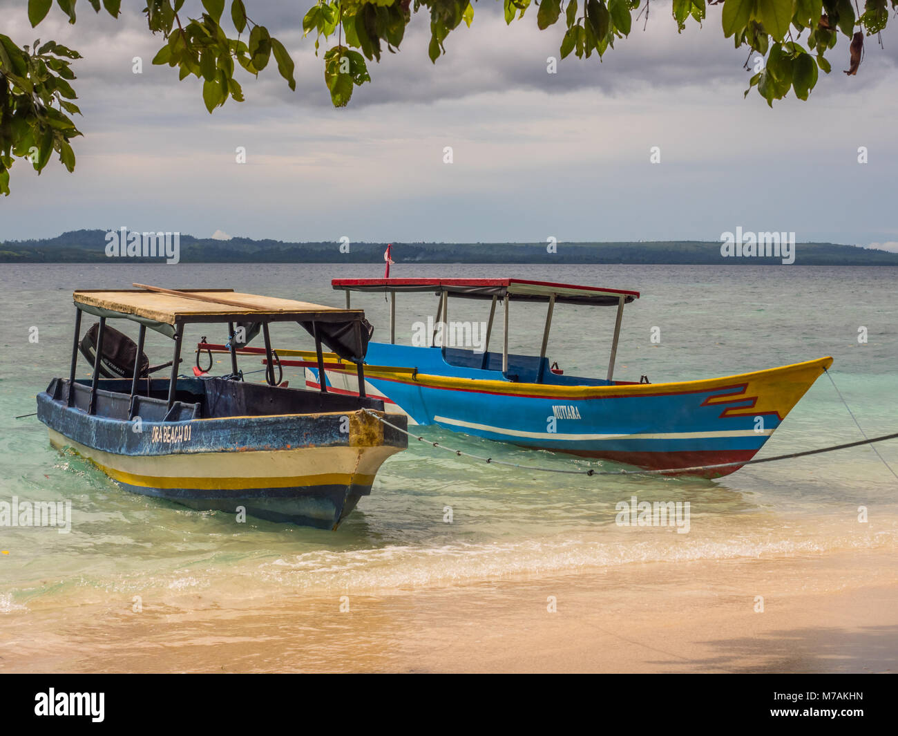 Ora Beach, Indonesia - February 12, 2018: Boats on the tropical beach ...