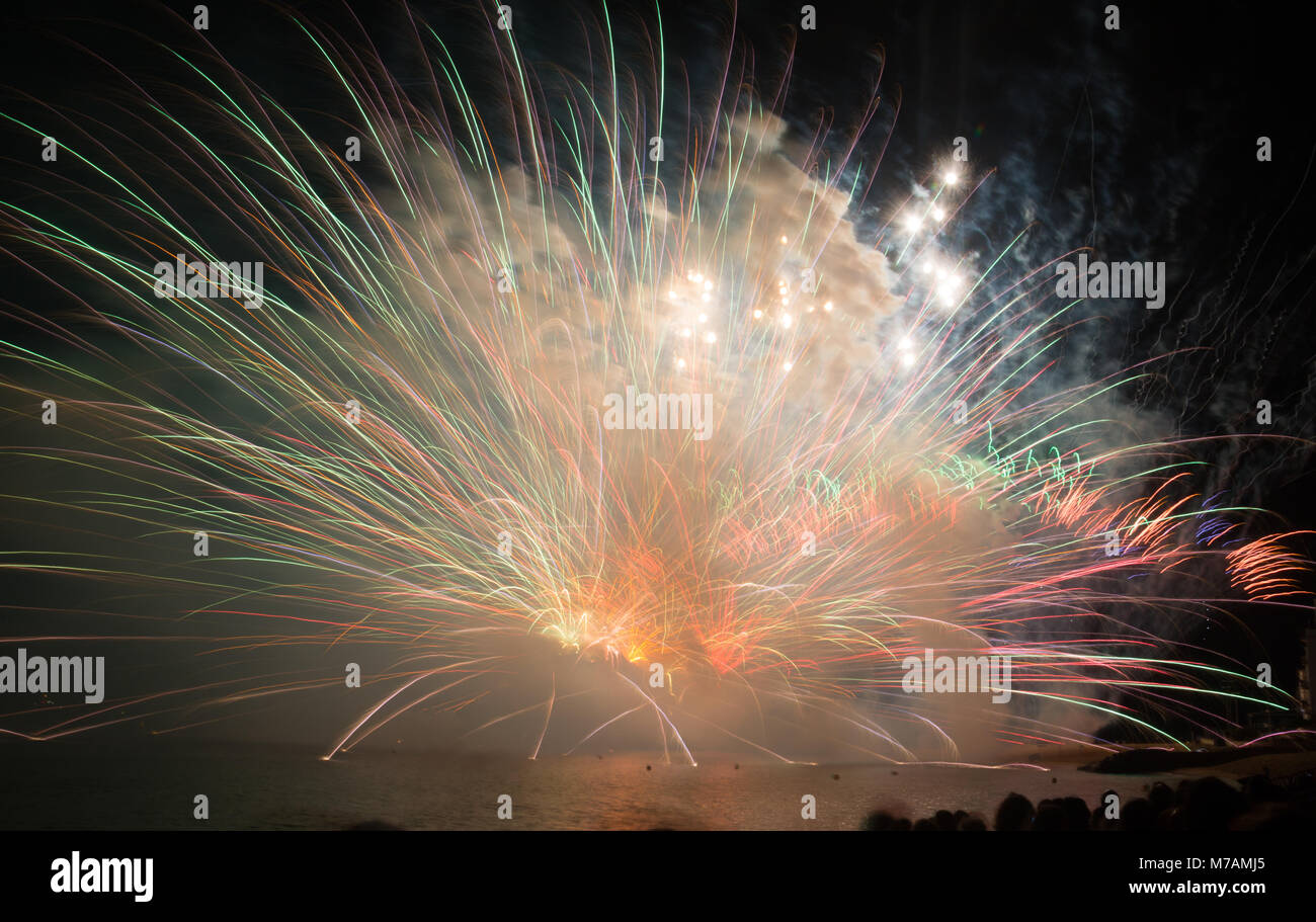 Colorful fireworks display on night sky background Stock Photo - Alamy