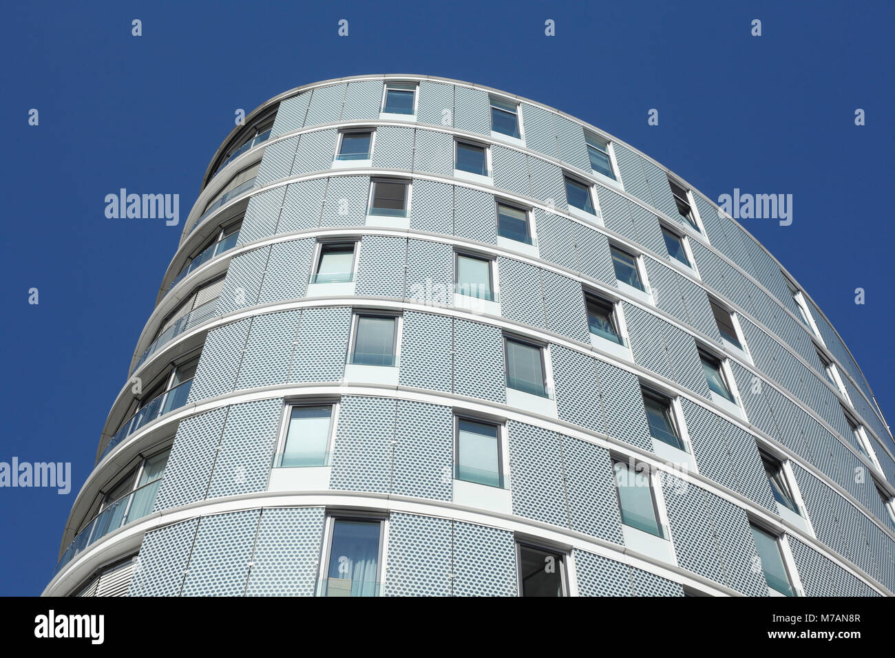 Round residential building, high rise, glass construction, harbour city ...