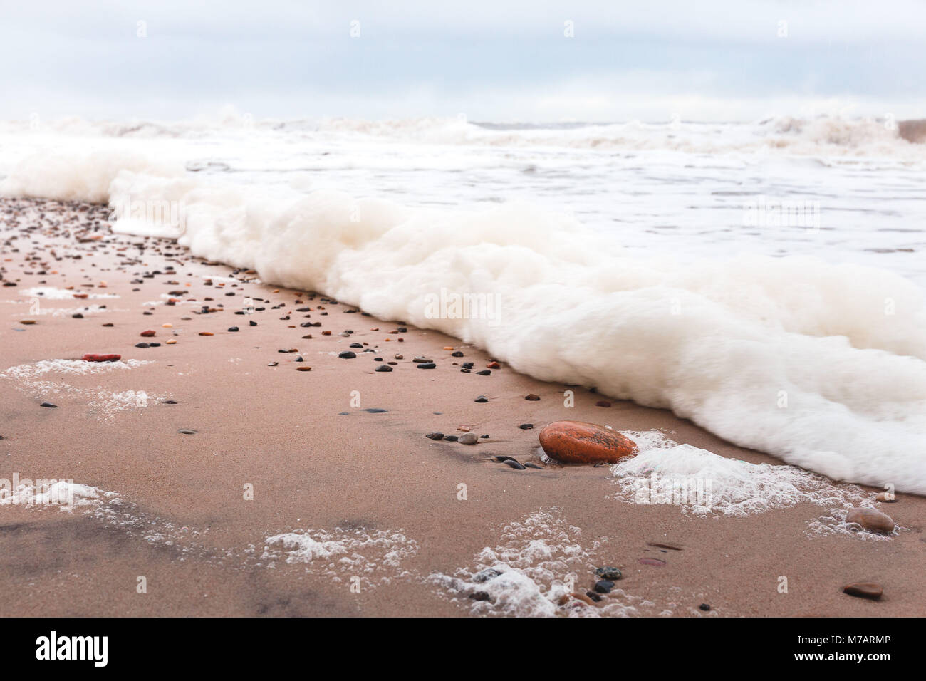 Water washed stone on beach near Hvide Sande Stock Photo - Alamy