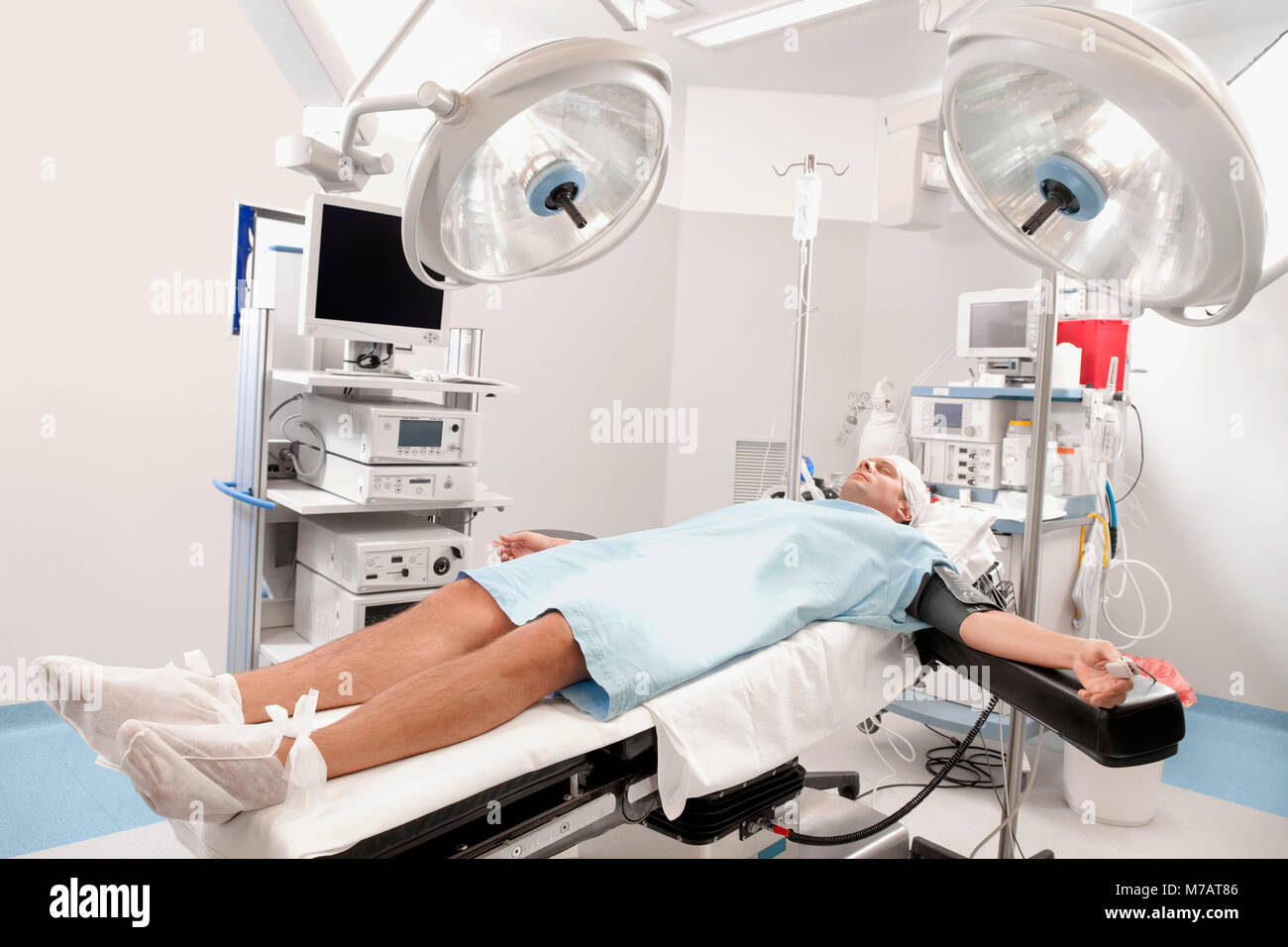 Patient lying down on an examination table hi-res stock photography and ...