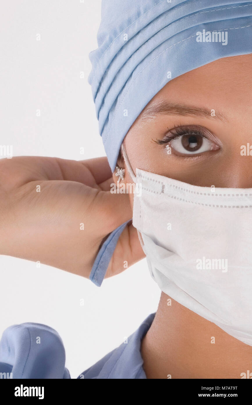 Female doctor wearing surgical mask Stock Photo - Alamy