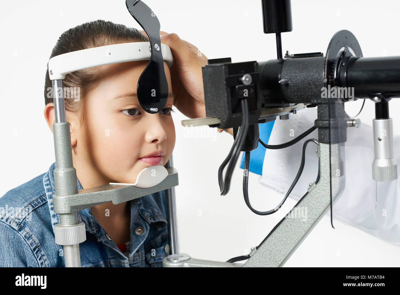 Girl having sight test Stock Photo - Alamy