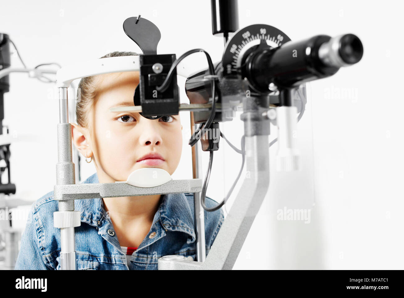 Girl having sight test Stock Photo - Alamy