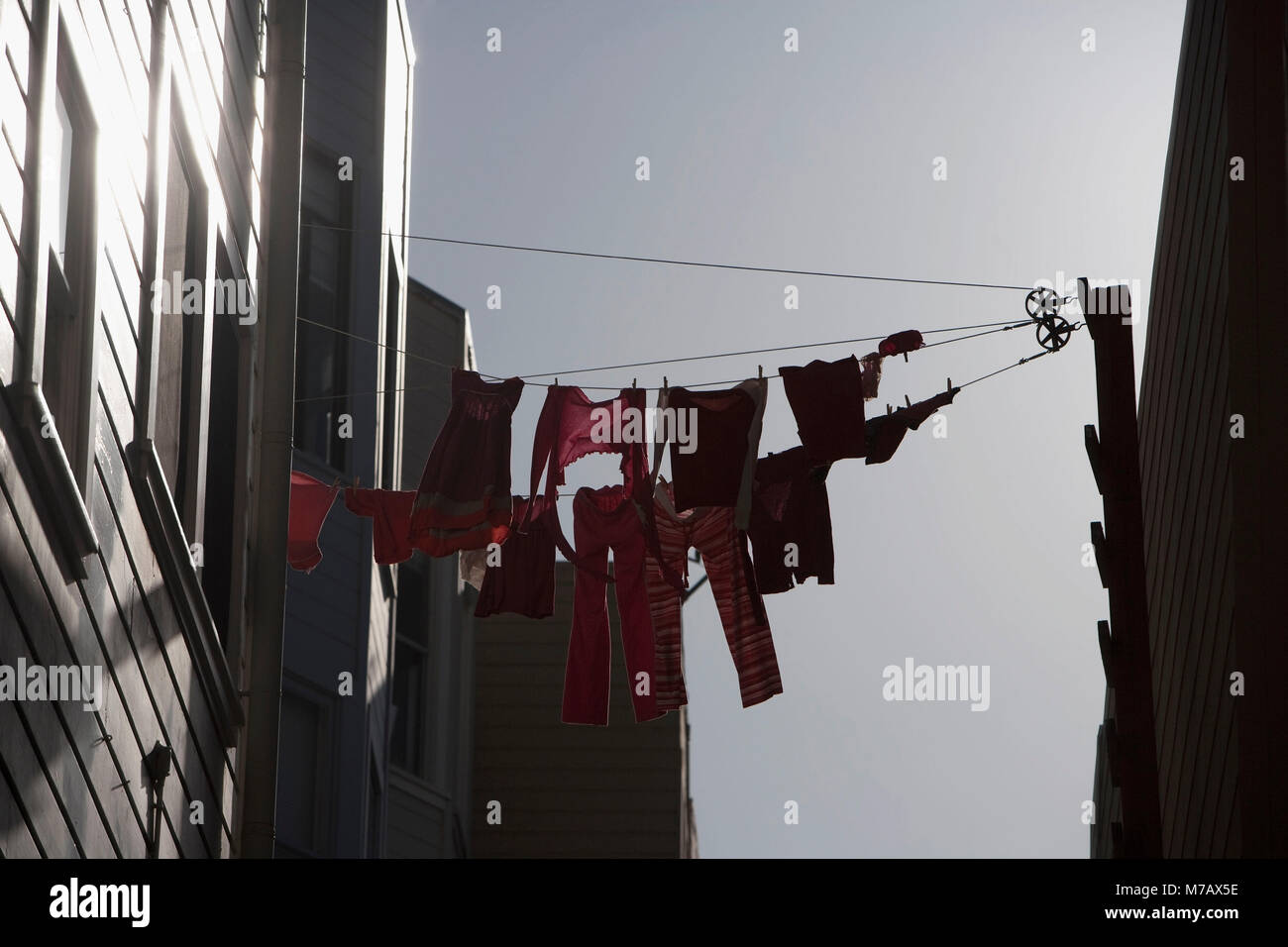 Low angle view of clothes drying on clotheslines, San Francisco ...