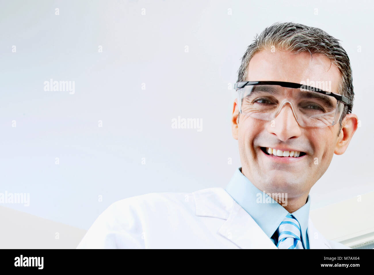 Portrait of a dentist smiling Stock Photo - Alamy