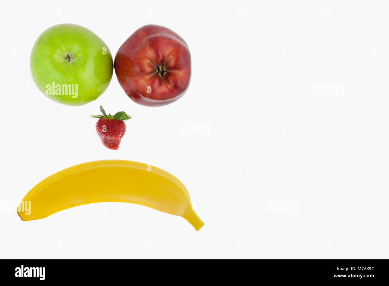 Unhappy face made up with fruits Stock Photo - Alamy