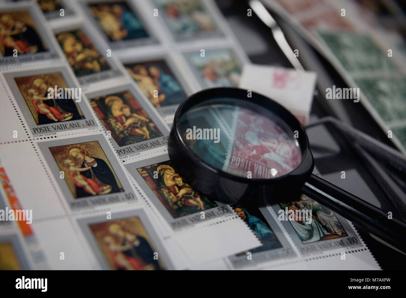 Magnifying glass over stamps hi-res stock photography and images - Alamy