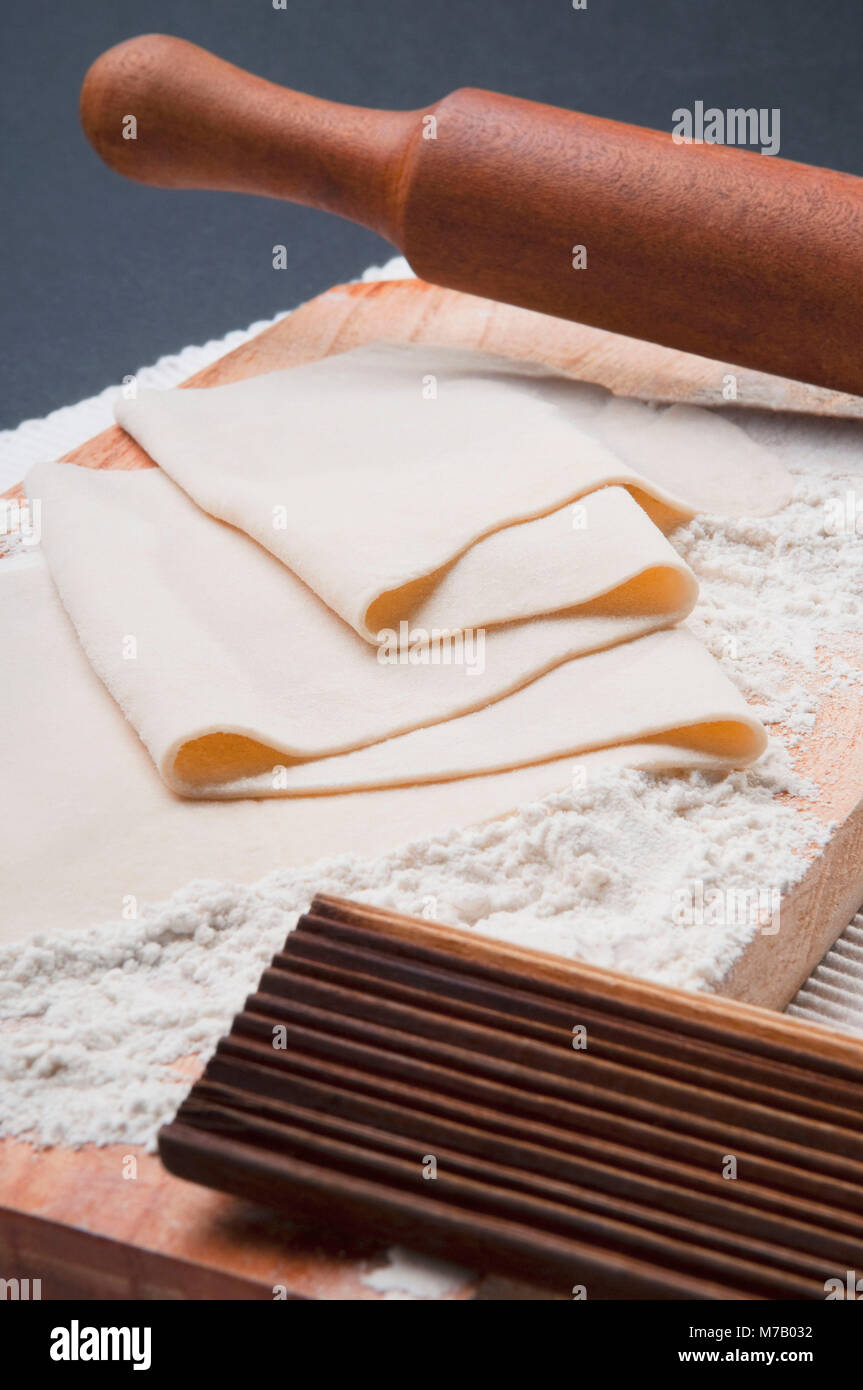 Close-up of dough with mould and a rolling pin Stock Photo - Alamy