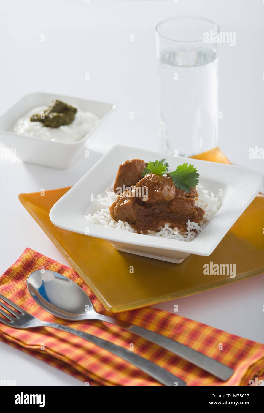Close-up of mutton curry served with rice Stock Photo - Alamy