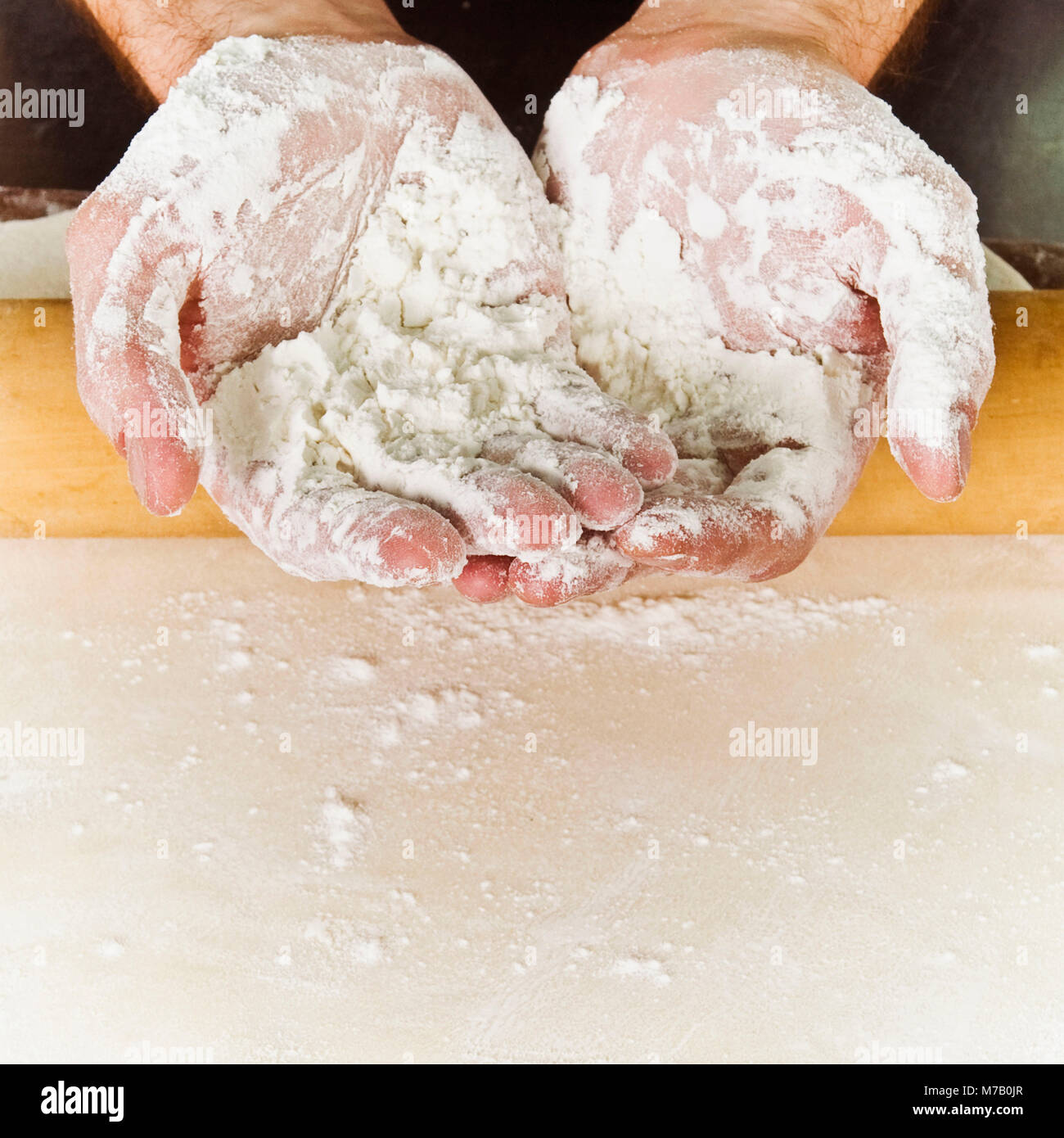 Chef's hands covered with flour Stock Photo - Alamy