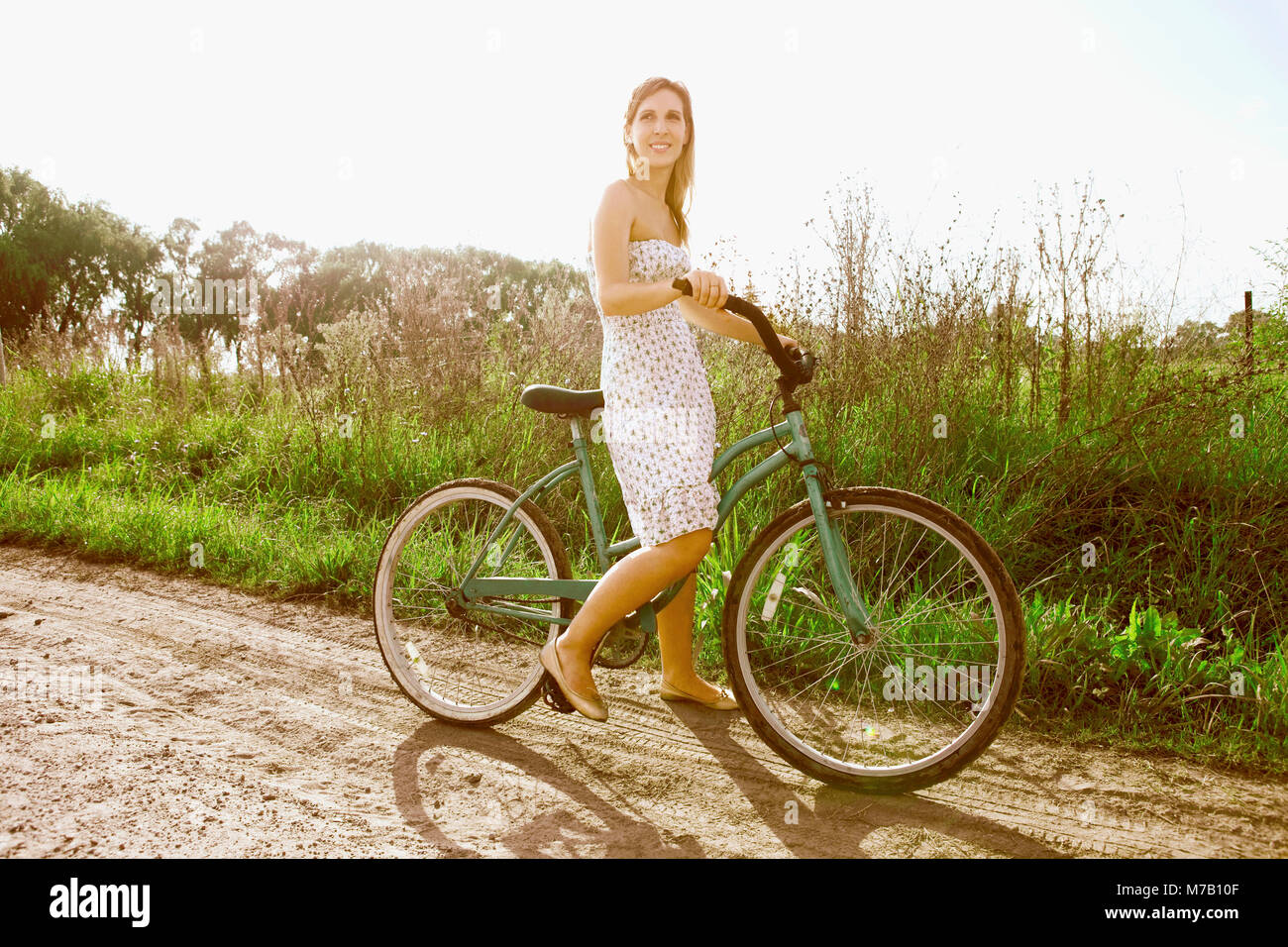 Woman riding a bicycle Stock Photo - Alamy