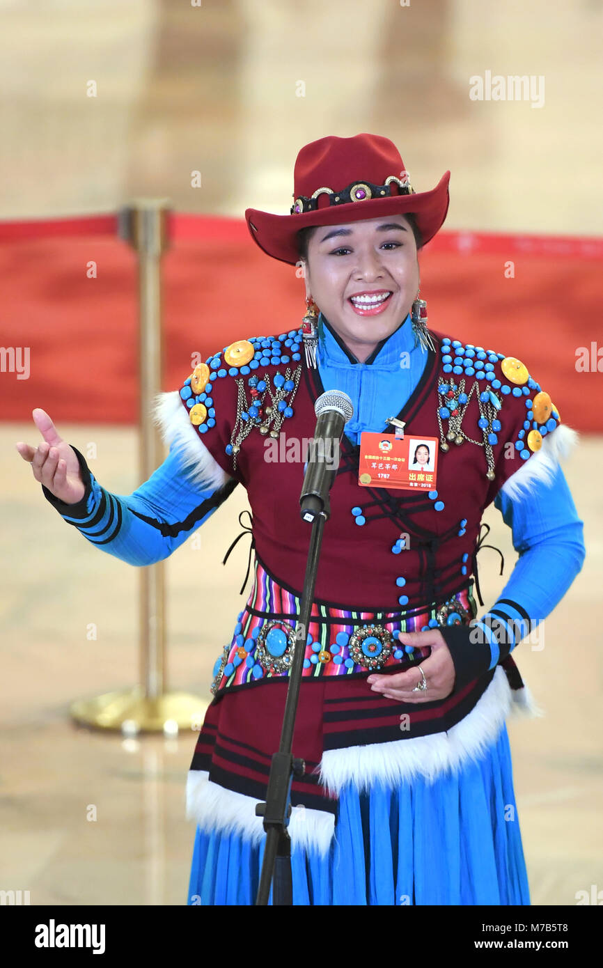 Beijing, China. 10th Mar, 2018. Rongba Xinna, a member of the 13th ...