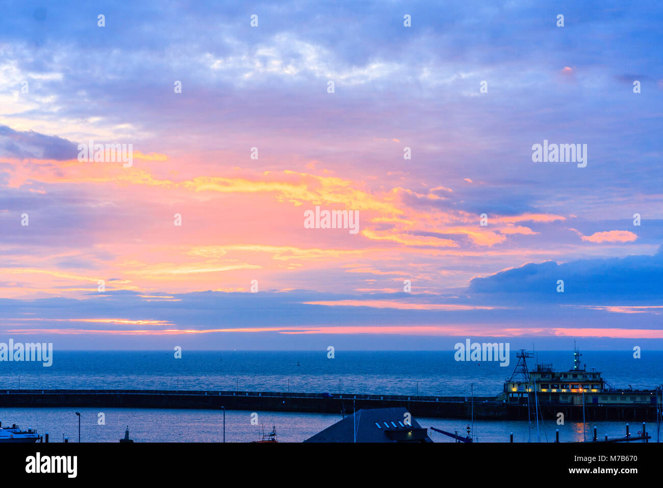 England, Ramsgate harbour. Dawn over the English channel. Clouds and ...