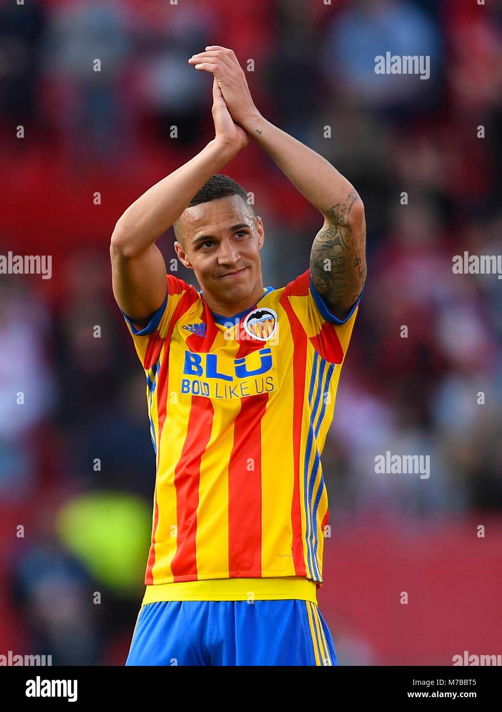 Seville, Spain. 10th Mar, 2018. Rodrigo of Valencia CF celebrates ...
