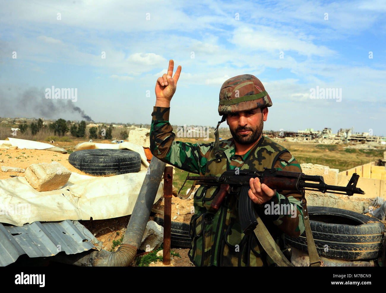 Damascus, Syria. 10th Mar, 2018. A Syrian soldier flashes a victory ...