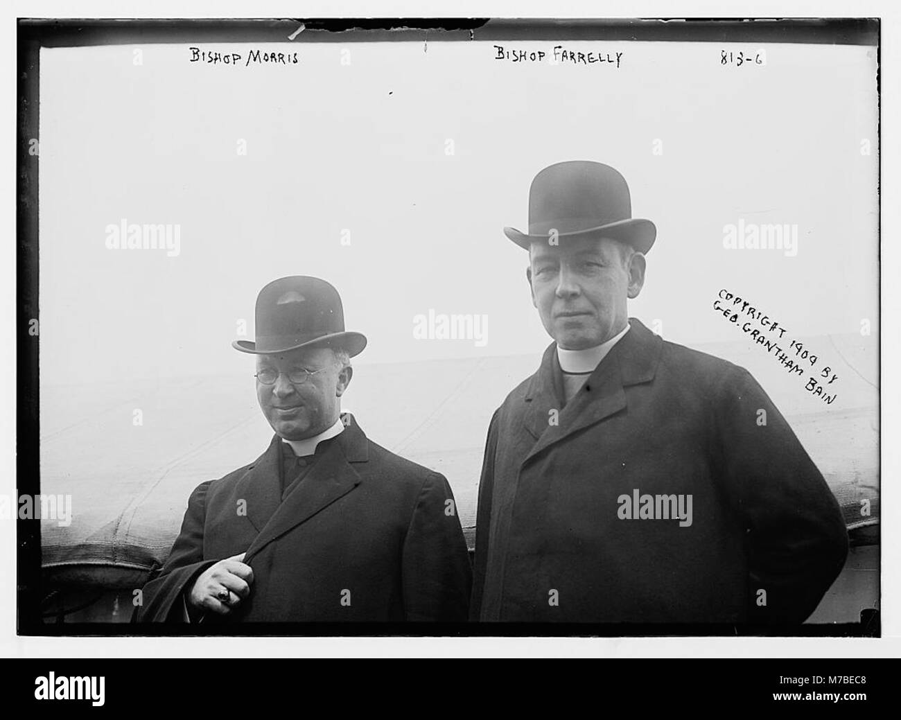 The image shows Bishops Morris and Farrelly aboard a boat, likely ...