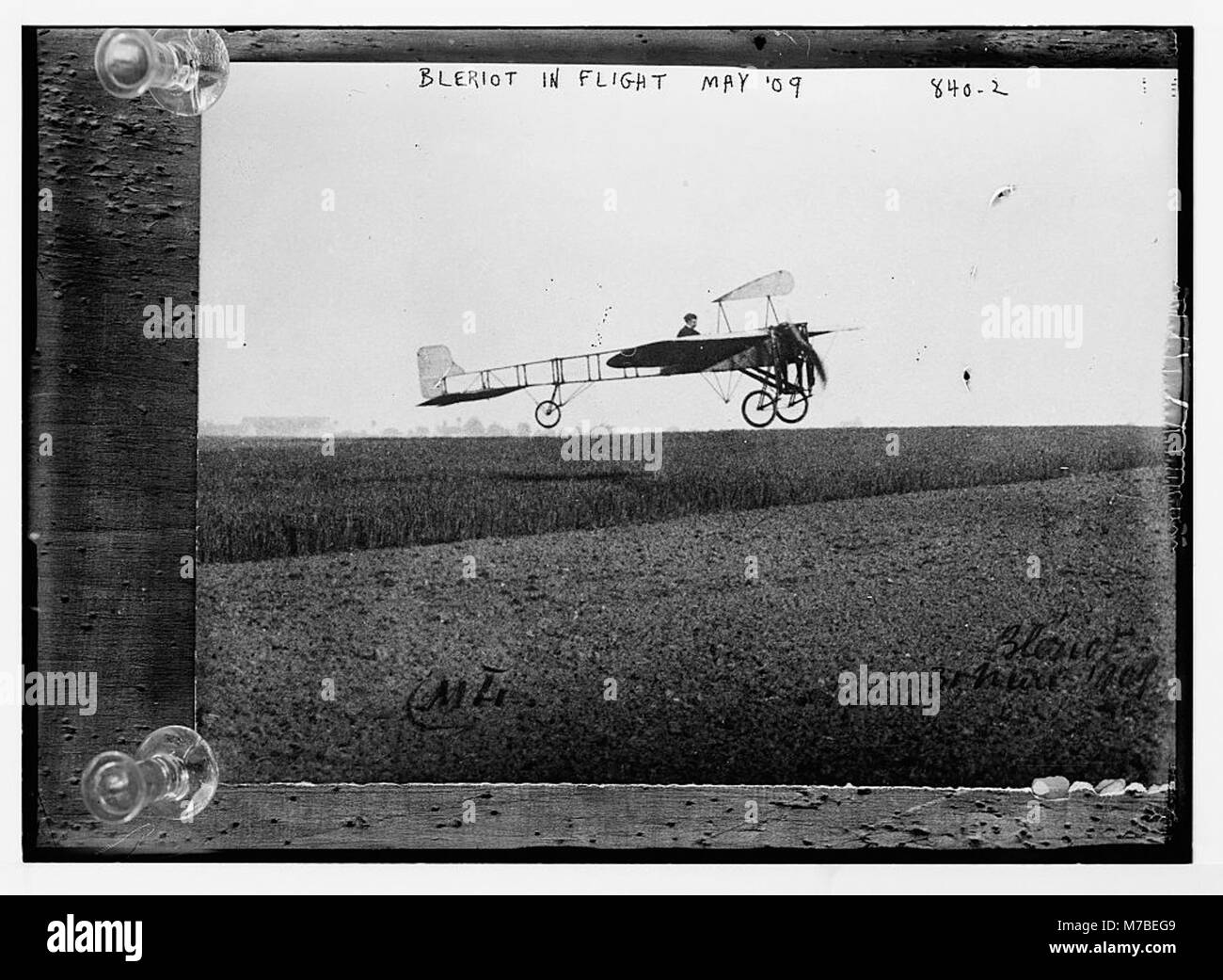A photograph of Louis Blériot, the French aviator, in flight over a ...