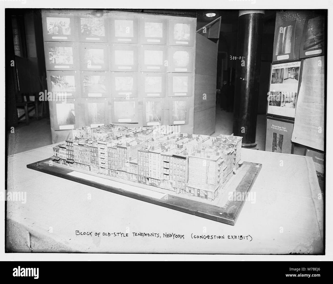A photo of a block of old-style tenement buildings in New York, showing ...