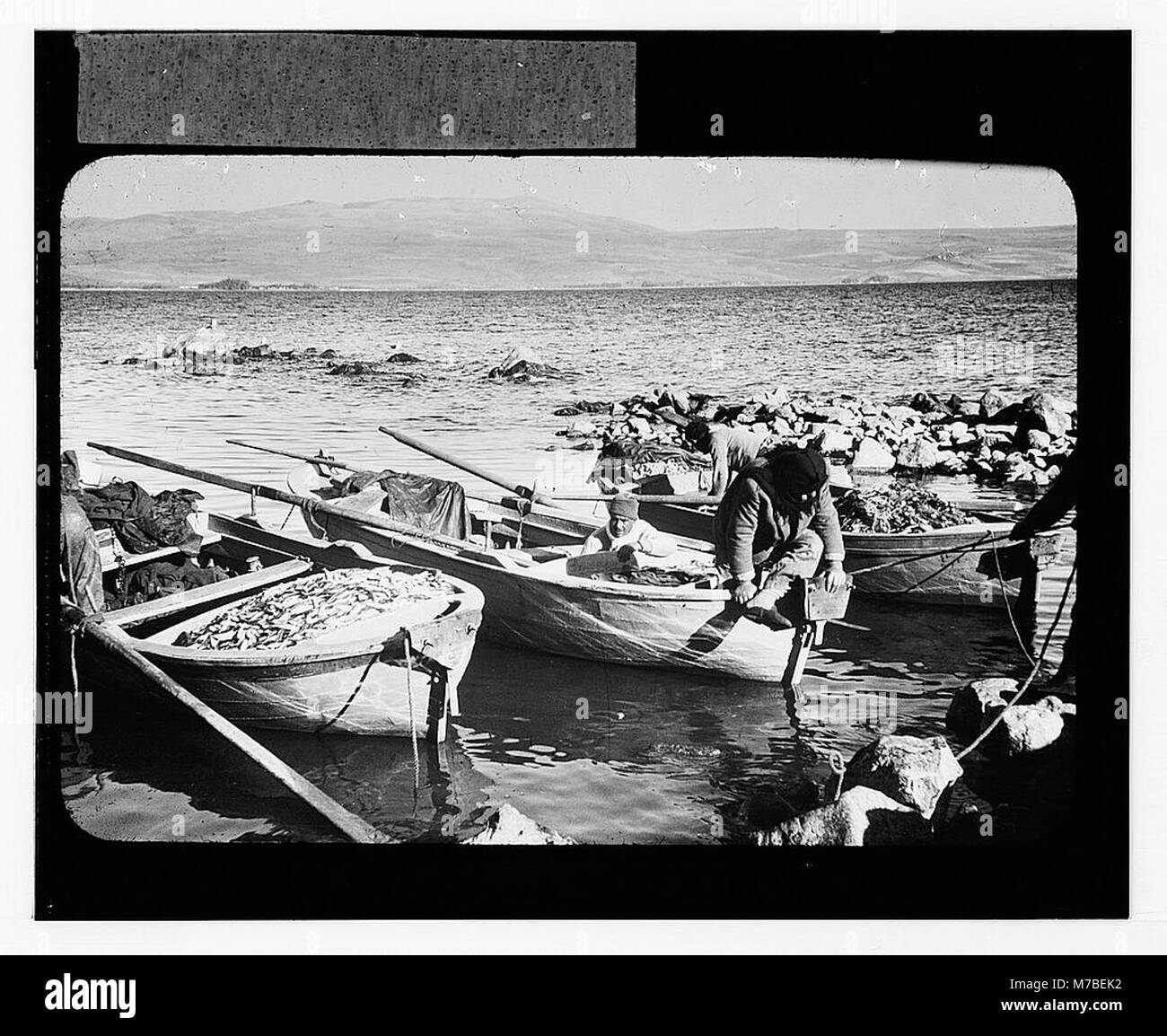 A depiction of boats on the Sea of Galilee, showing the serene waters ...